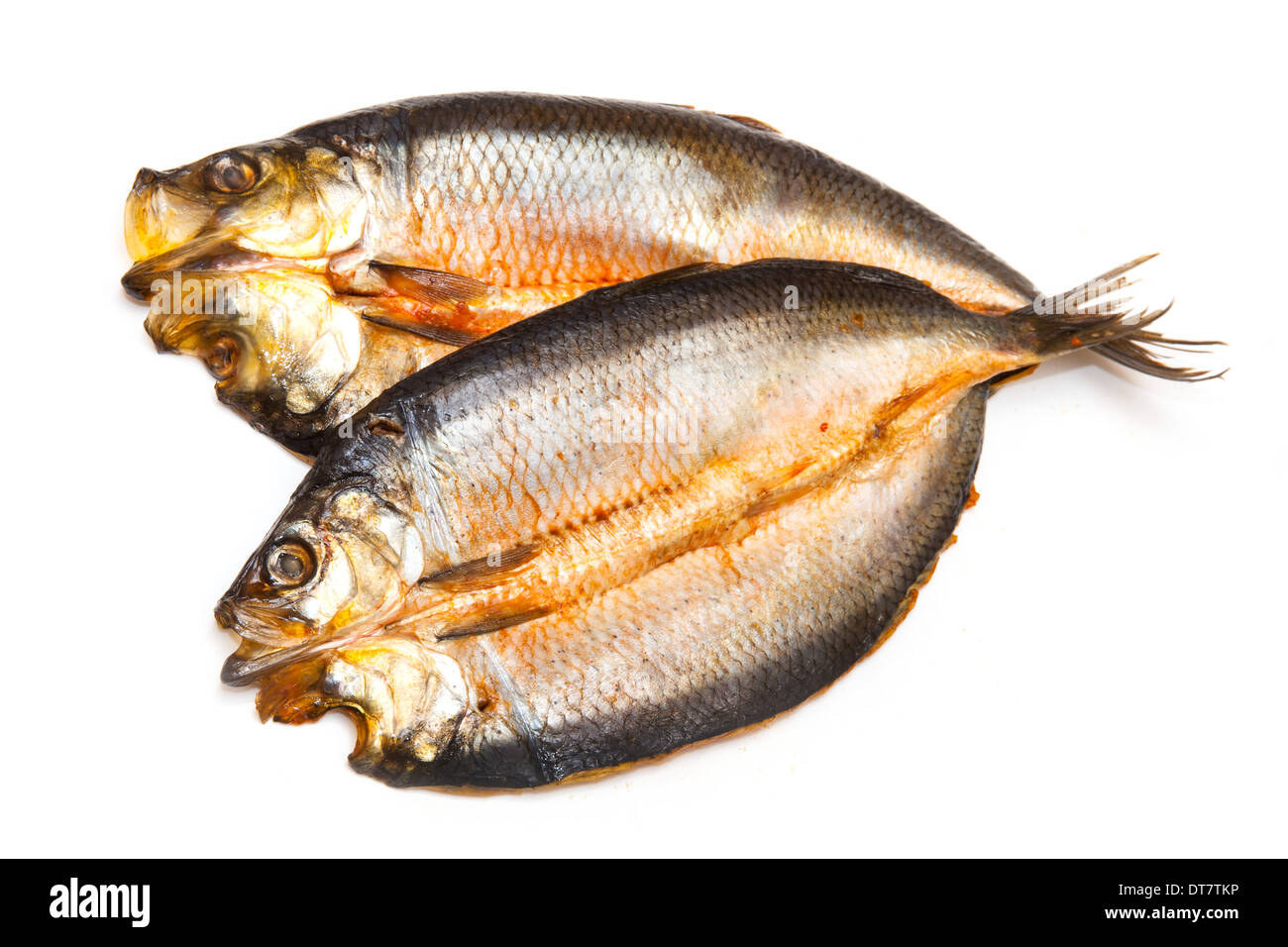 Dyed Scottish smoked kippers isolated on a white studio background ...
