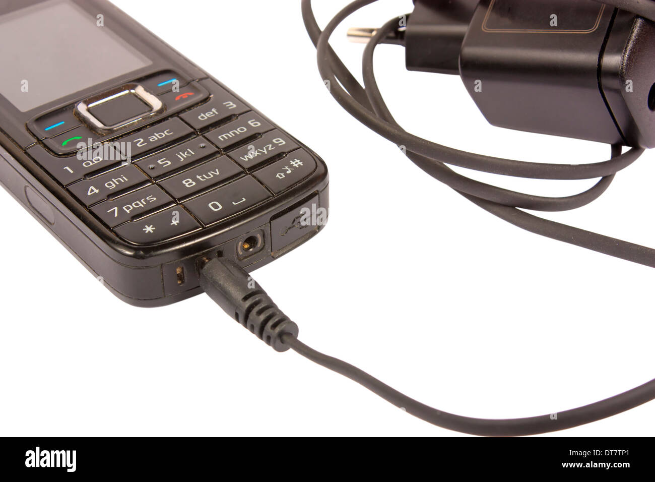 Charging mobile phone isolated on white background Stock Photo - Alamy