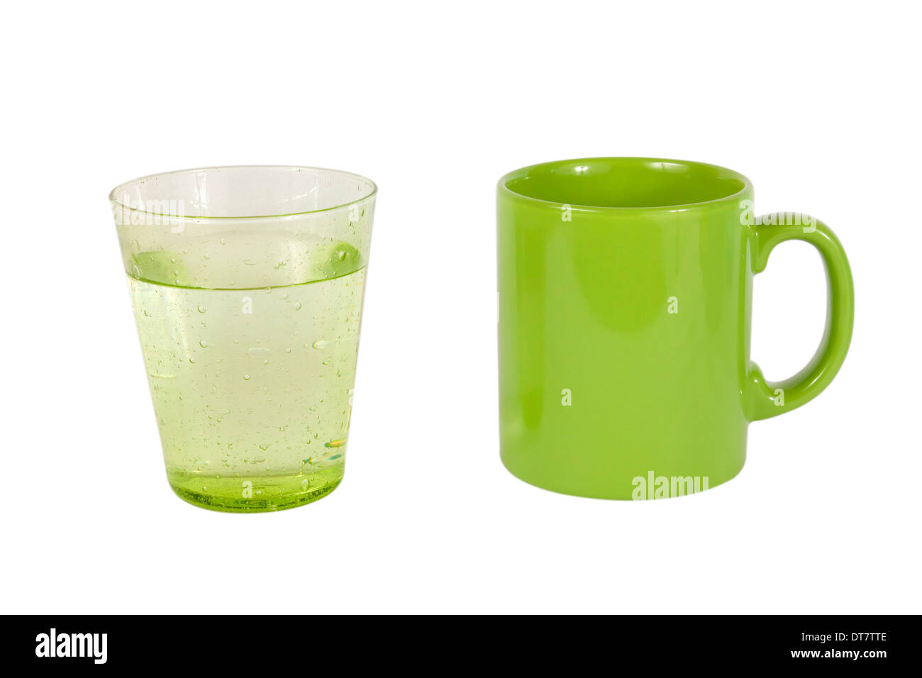 a glass of water and one green cup isolated on white background Stock ...