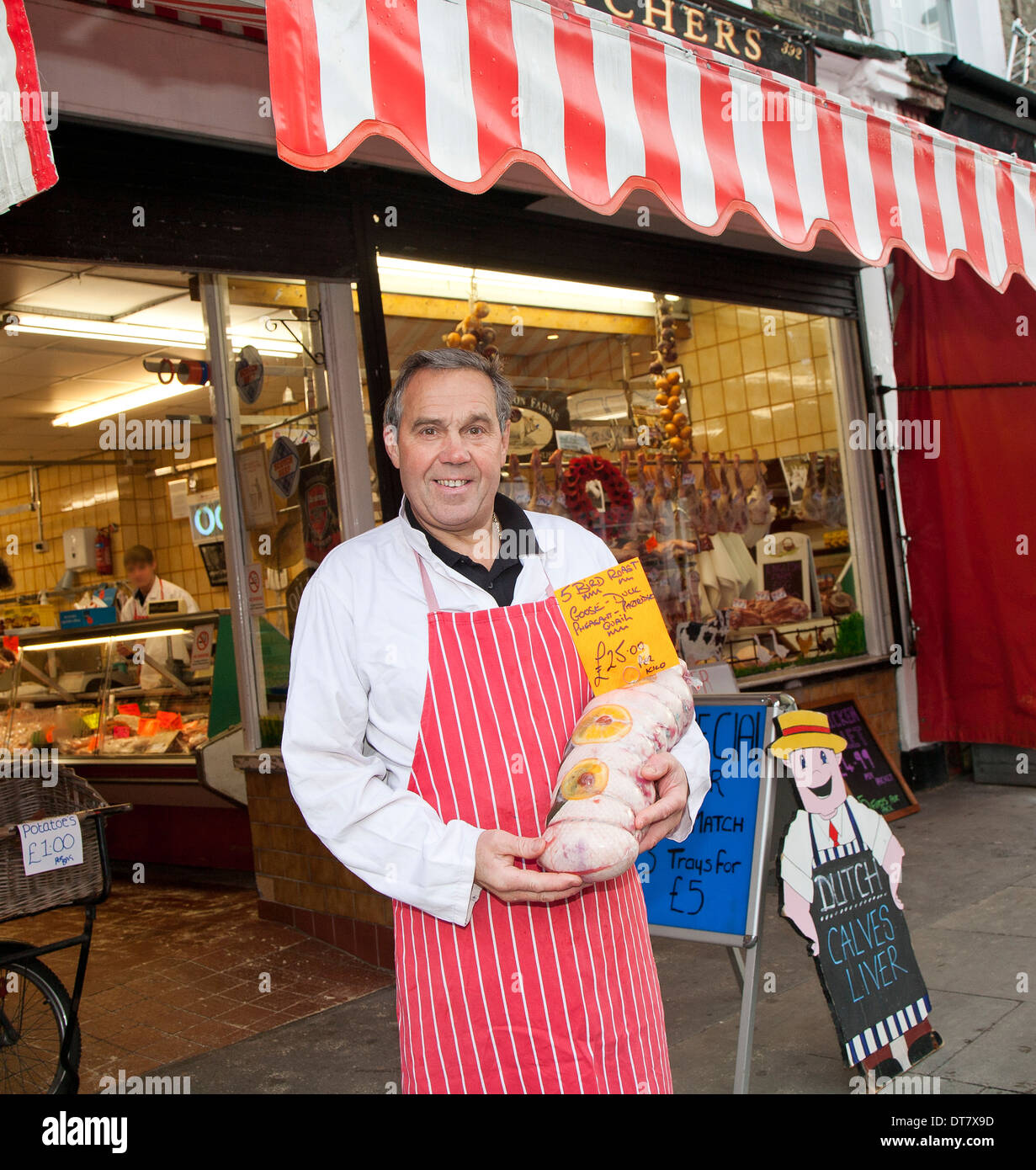 Butcher outside his shop Stock Photo - Alamy