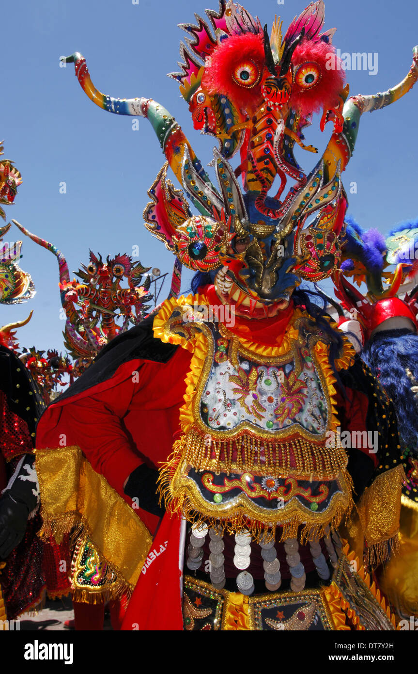 Participants diablada dancing, dance that represents fighting between ...