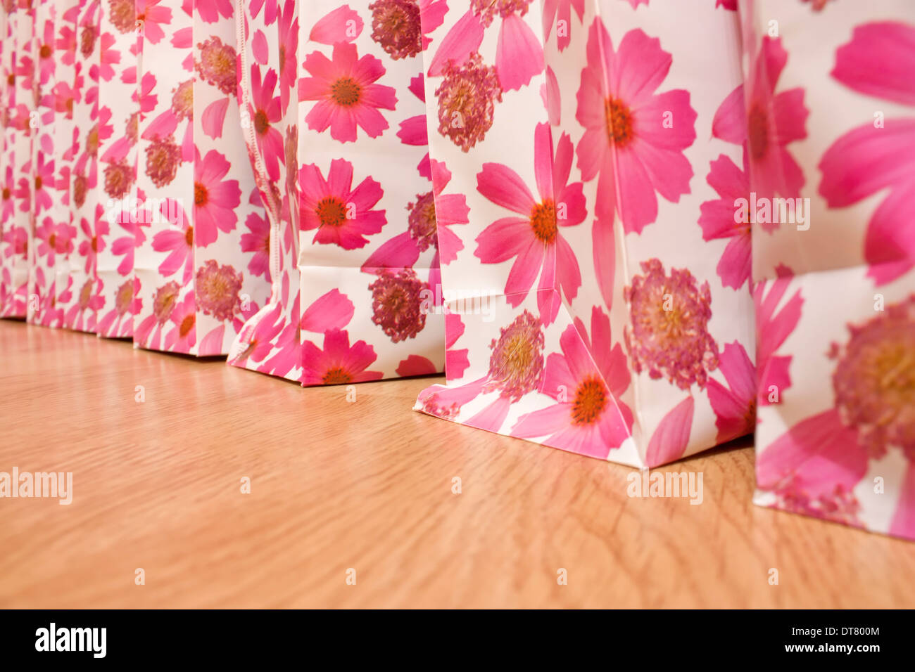 Christmas gifts in colorful wrapping on a beautiful hardwood floor ...