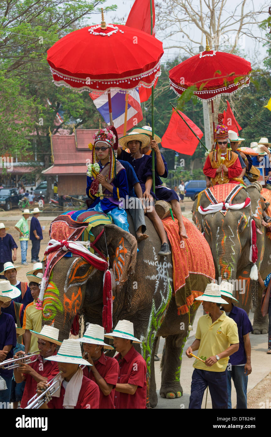 Initiates dressed in garish costumes and sunglasses being processed on ...