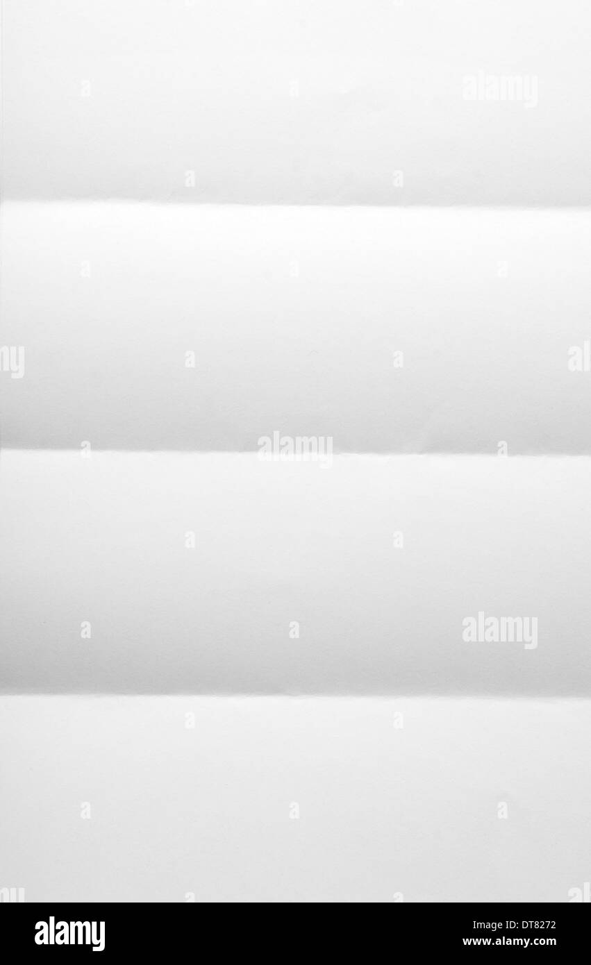 white textured sheet of paper folded in four Stock Photo - Alamy