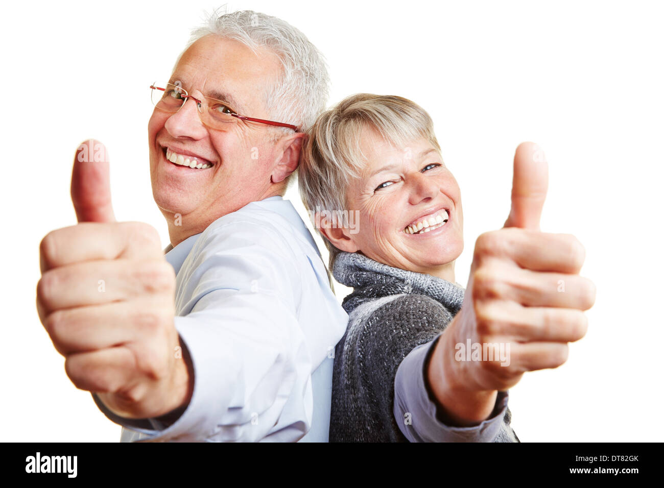 Happy elderly senior couple holding their thumbs up Stock Photo - Alamy