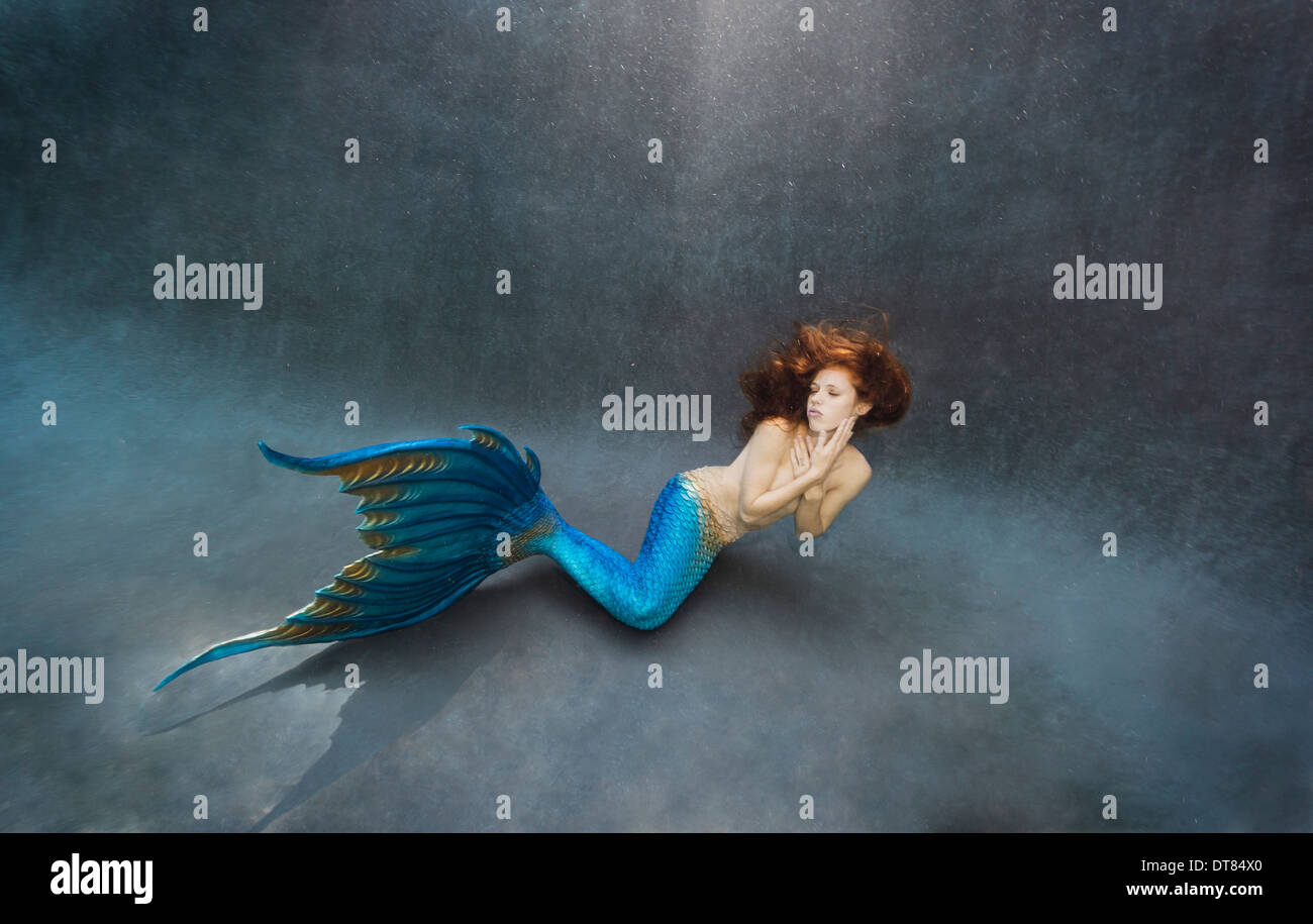 Redhead mermaid in a pool in Virginia Beach, Virginia Stock Photo - Alamy