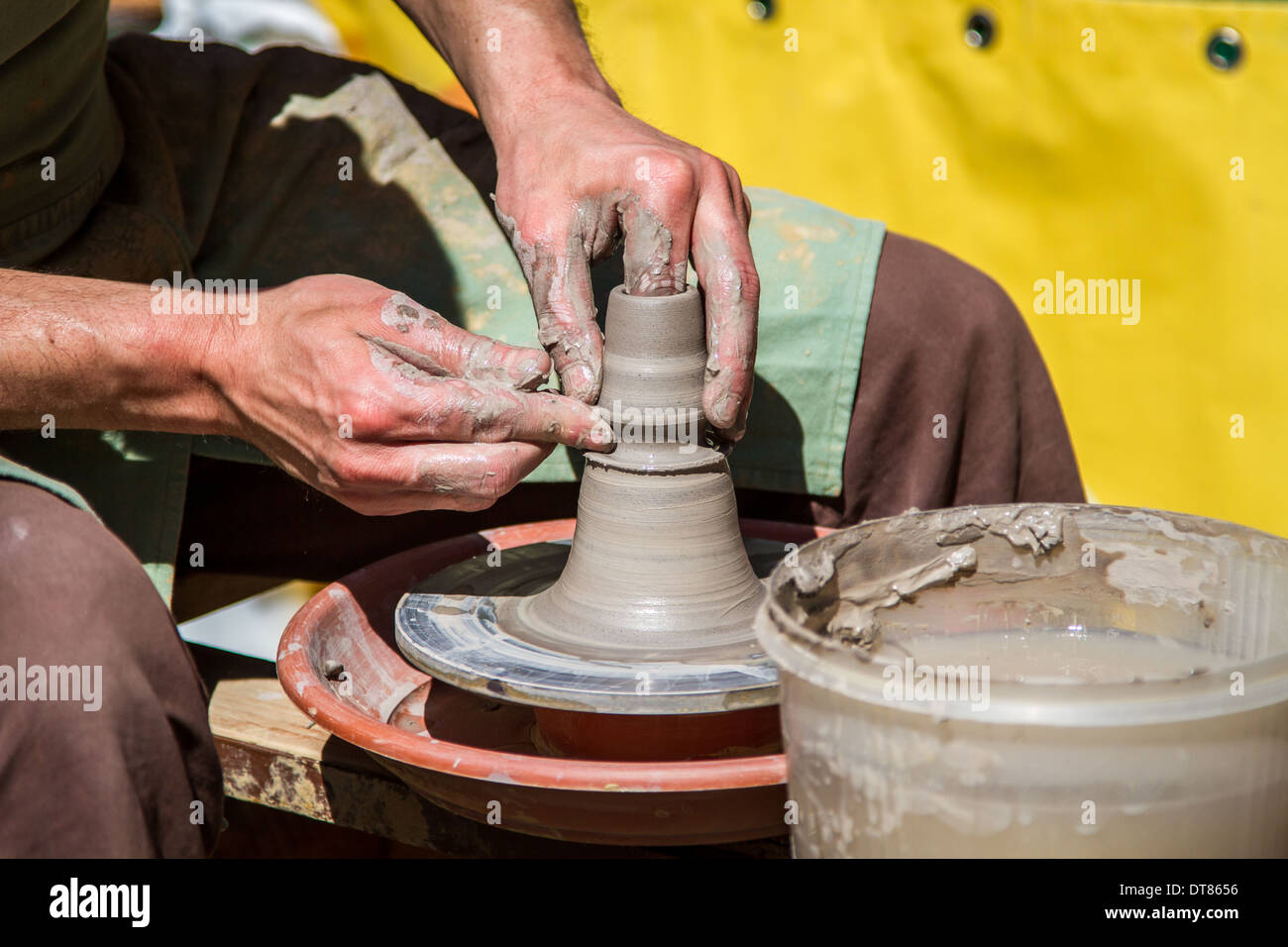Shaping pottery street work in Warsaw, Poland Stock Photo - Alamy