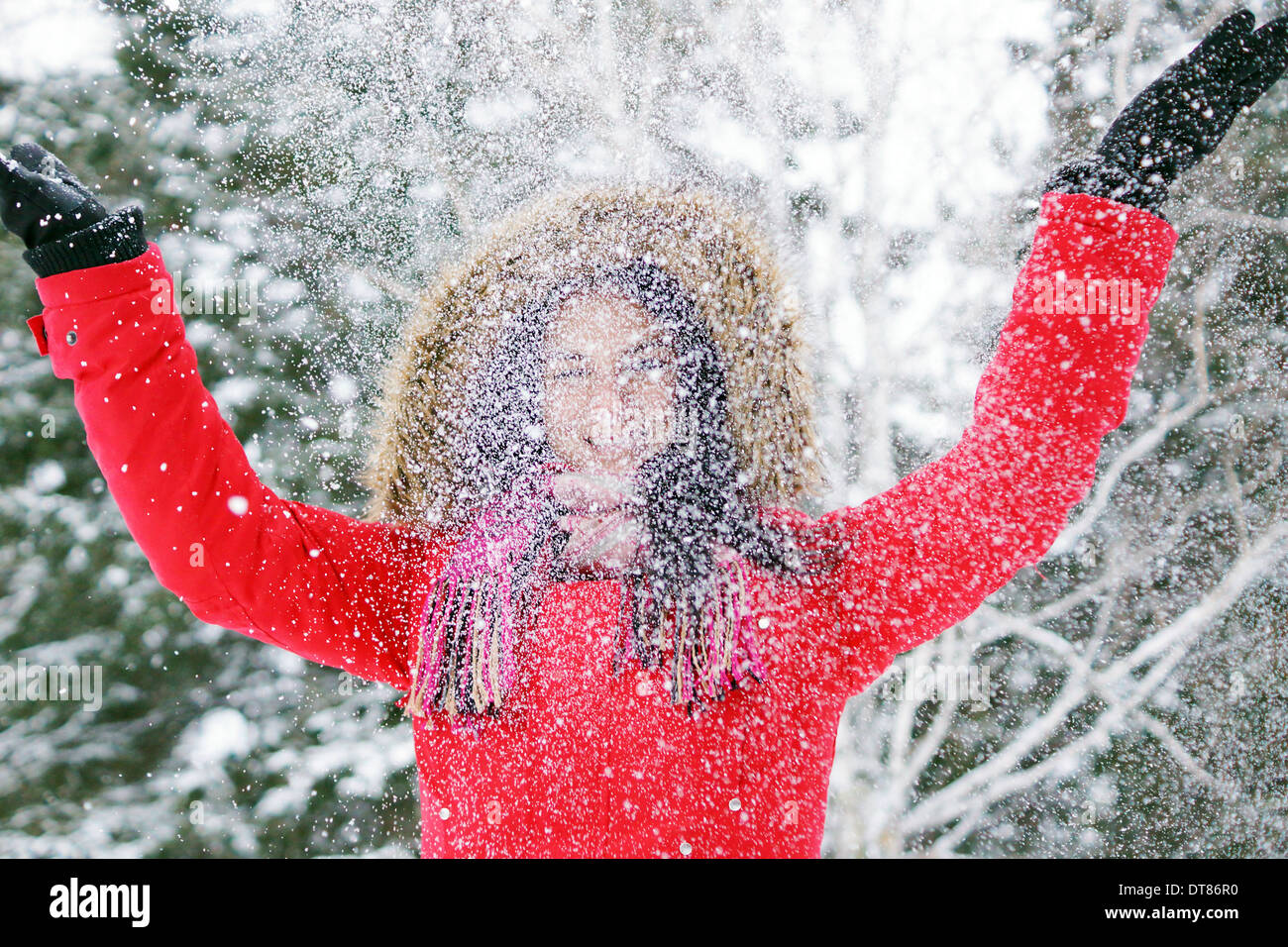 Woman throwing snow in the air, fun winter concept Stock Photo - Alamy