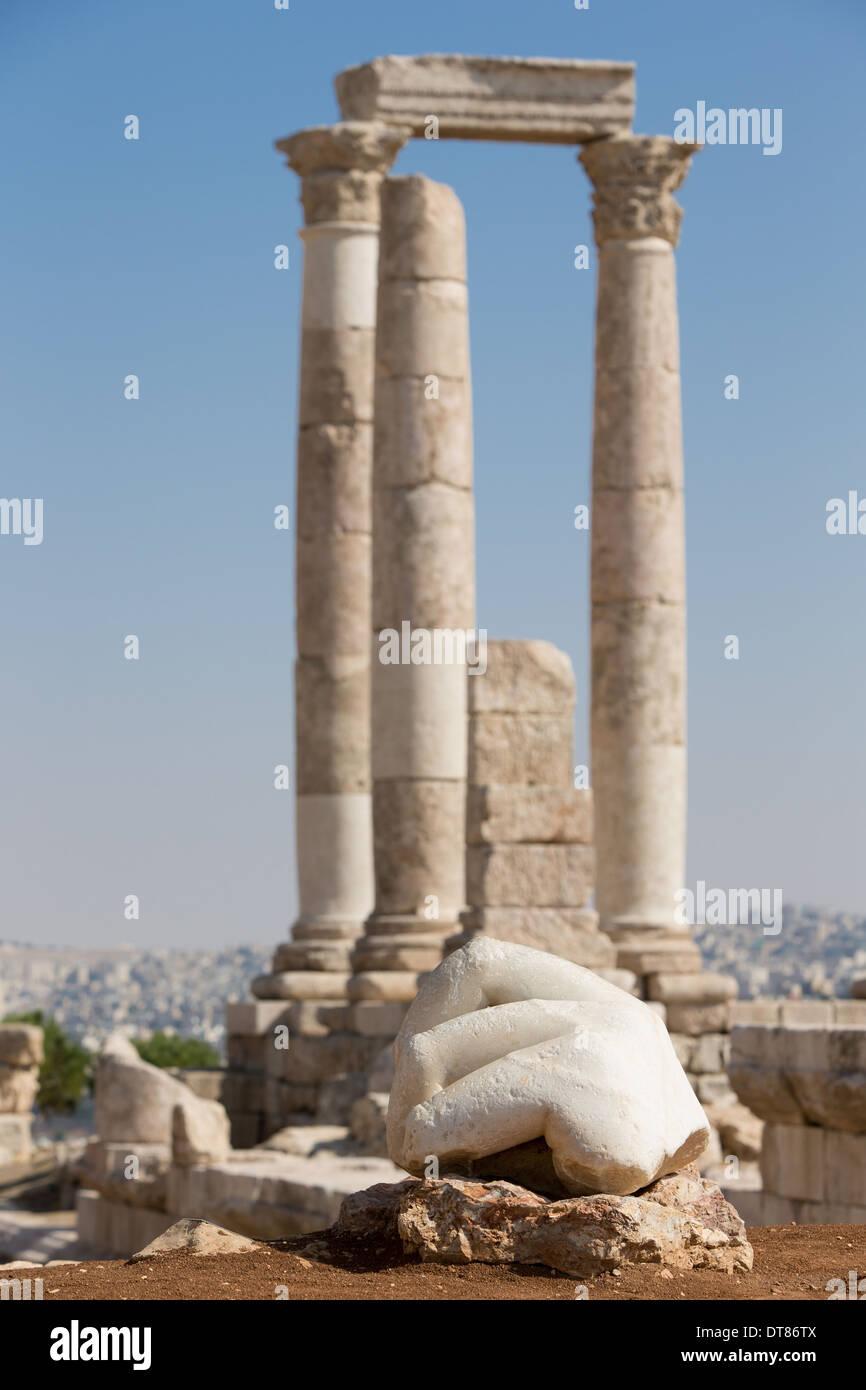 Marble hand in front of three Roman pillars at the Citadel in Amman ...