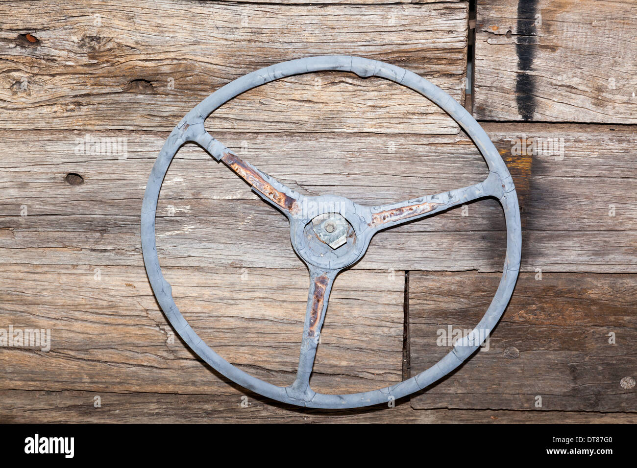 steering wheel against timber background Stock Photo - Alamy