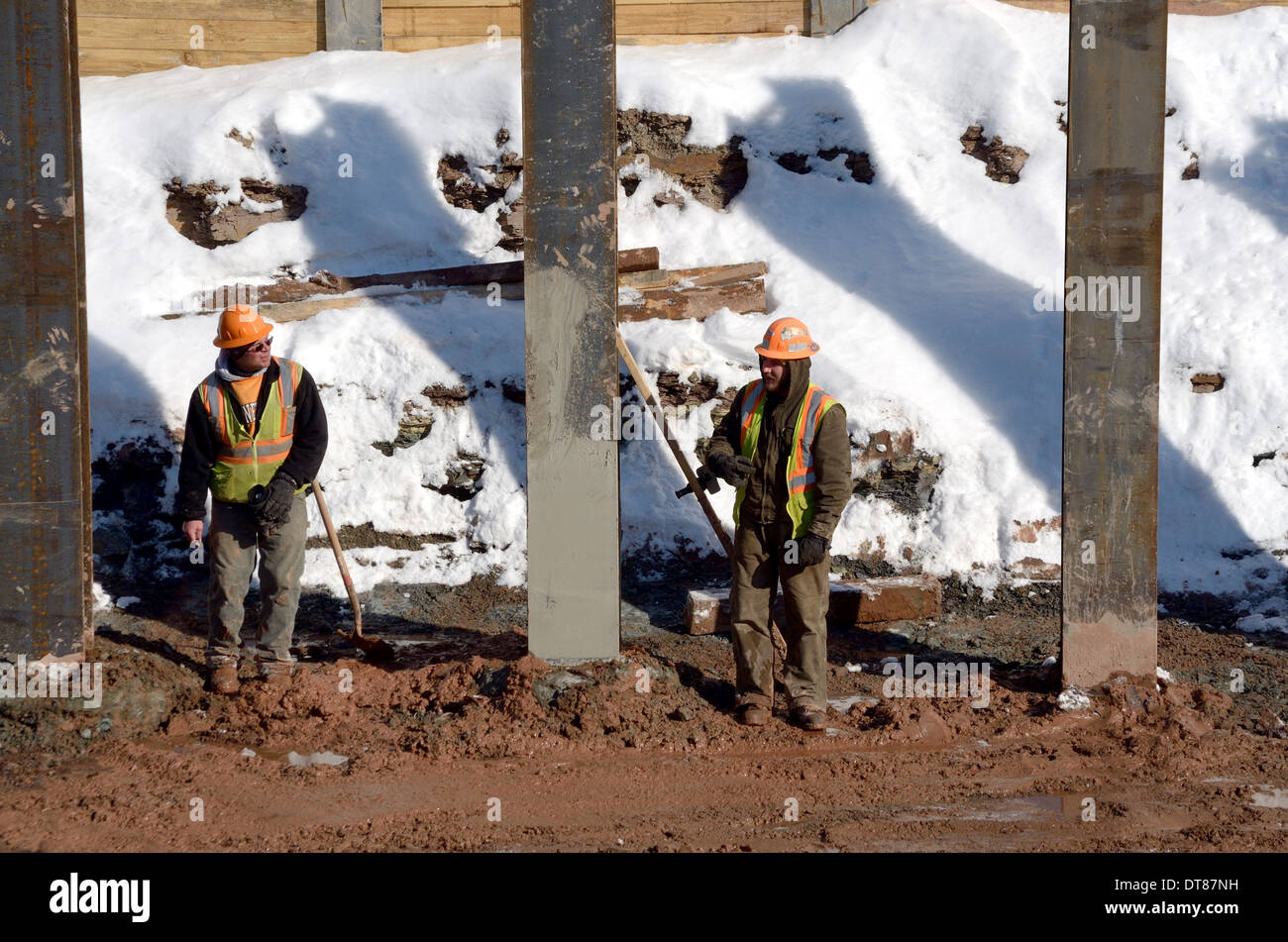Two construction men standing next to steel members of Erie Canal wall ...
