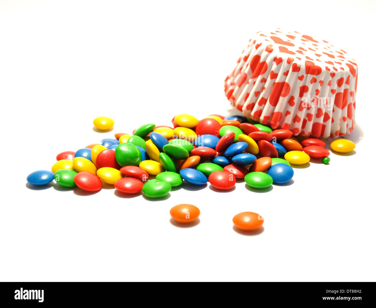 Coloured candies from a basket Stock Photo - Alamy