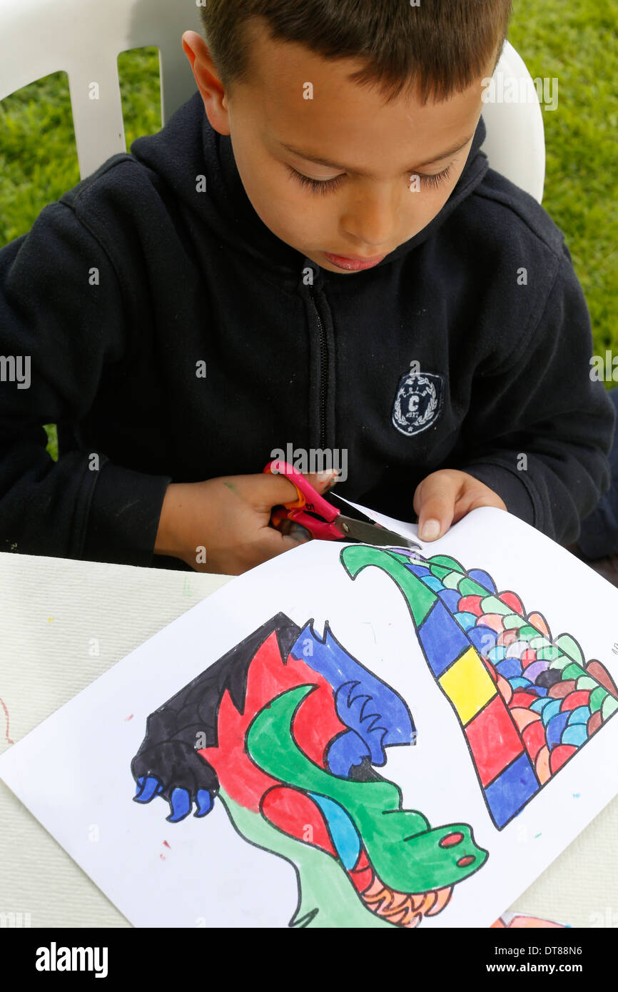 Boy Cutting Drawing Scissors High Resolution Stock Photography and ...