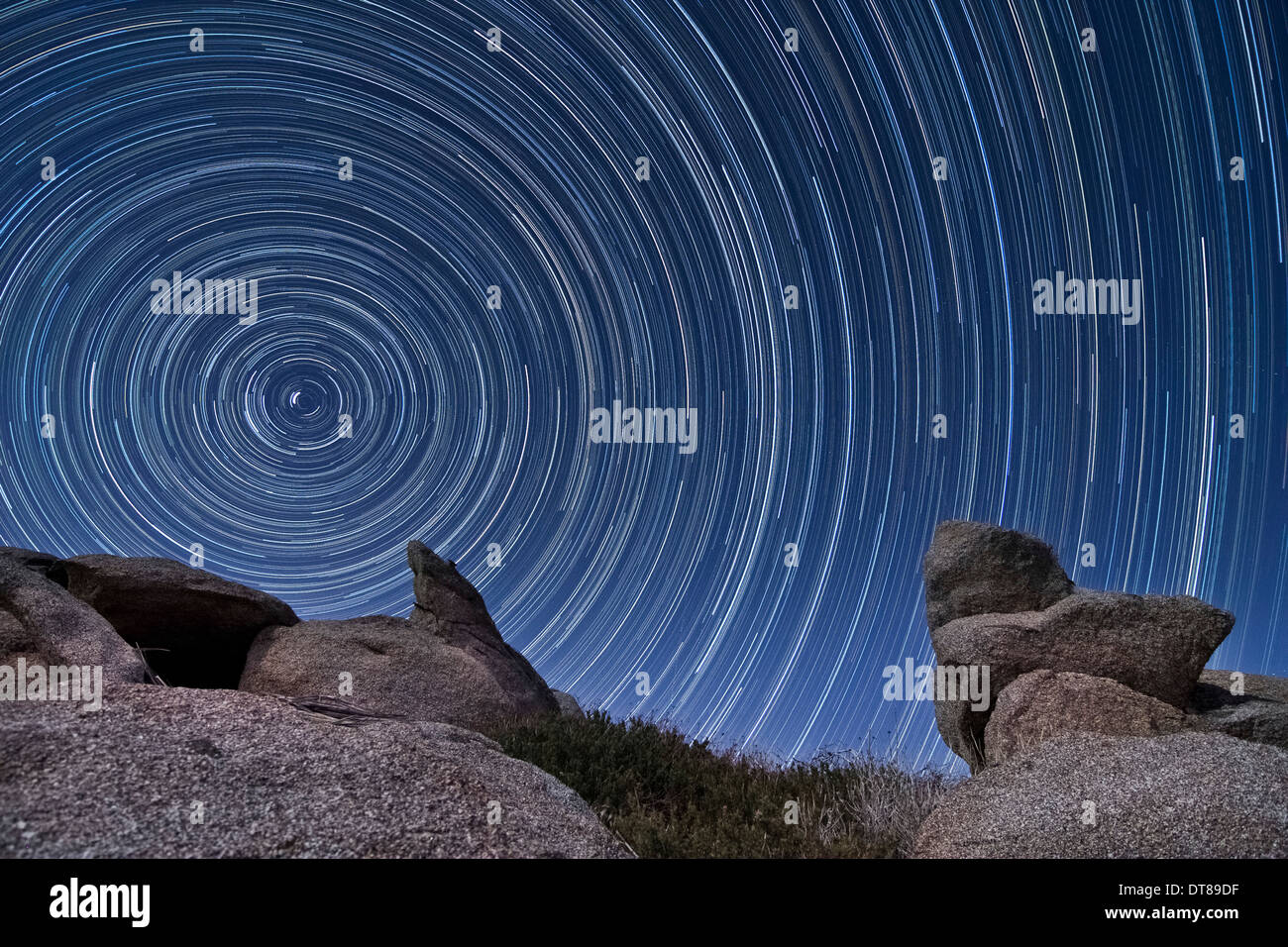 A boulder outcropping and star trails in the high desert of Anza ...