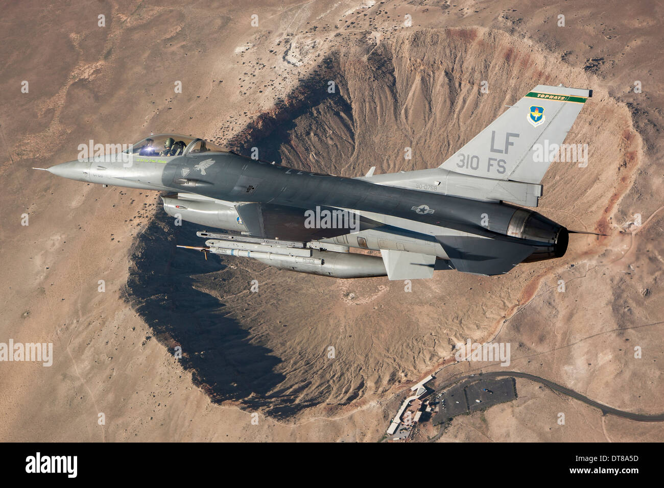 F-16C Fighting Falcon flying above Arizona's Meteor Crater Stock Photo ...
