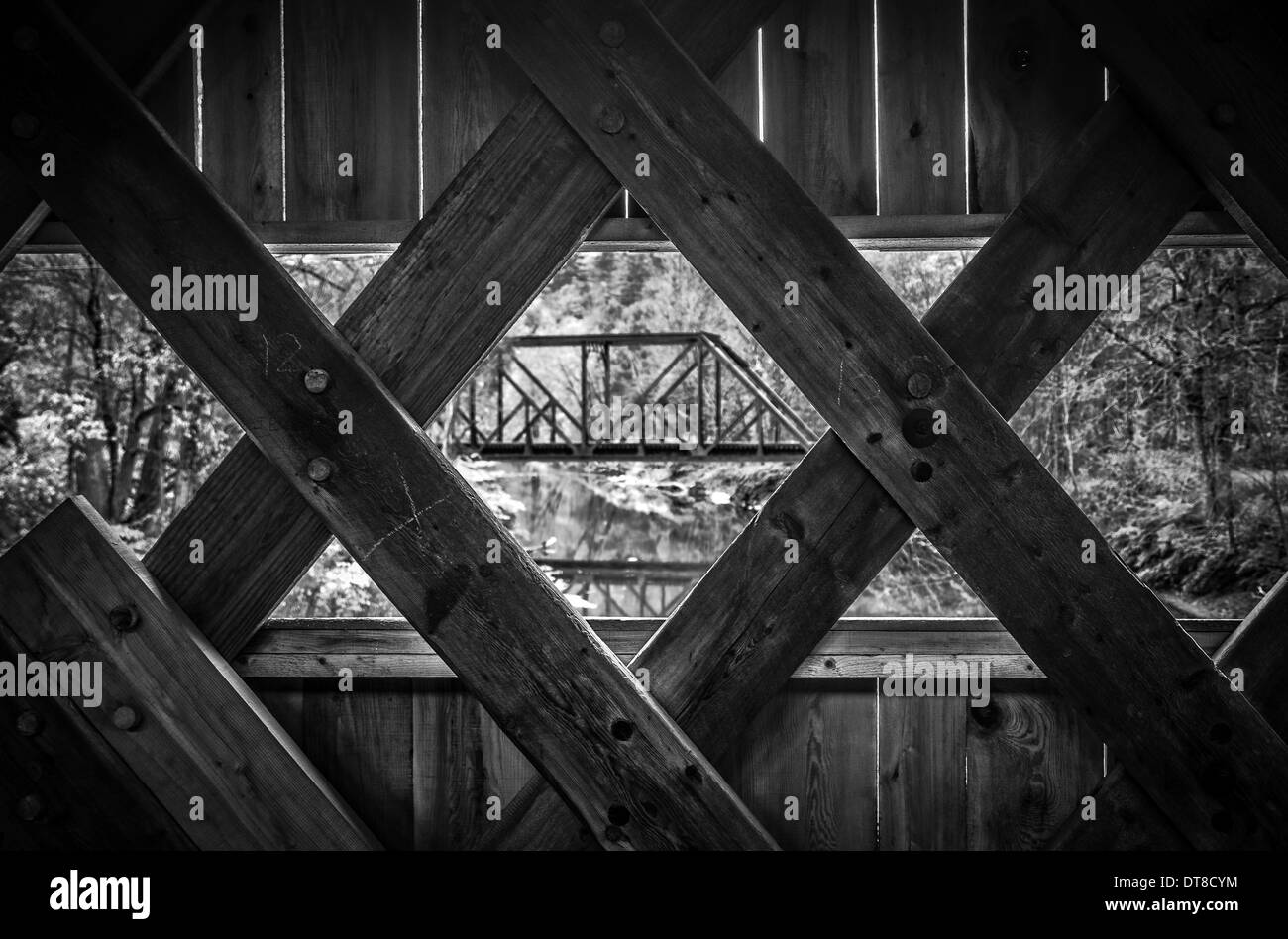 View from an old covered bridge in Vermont looking out towards an old ...