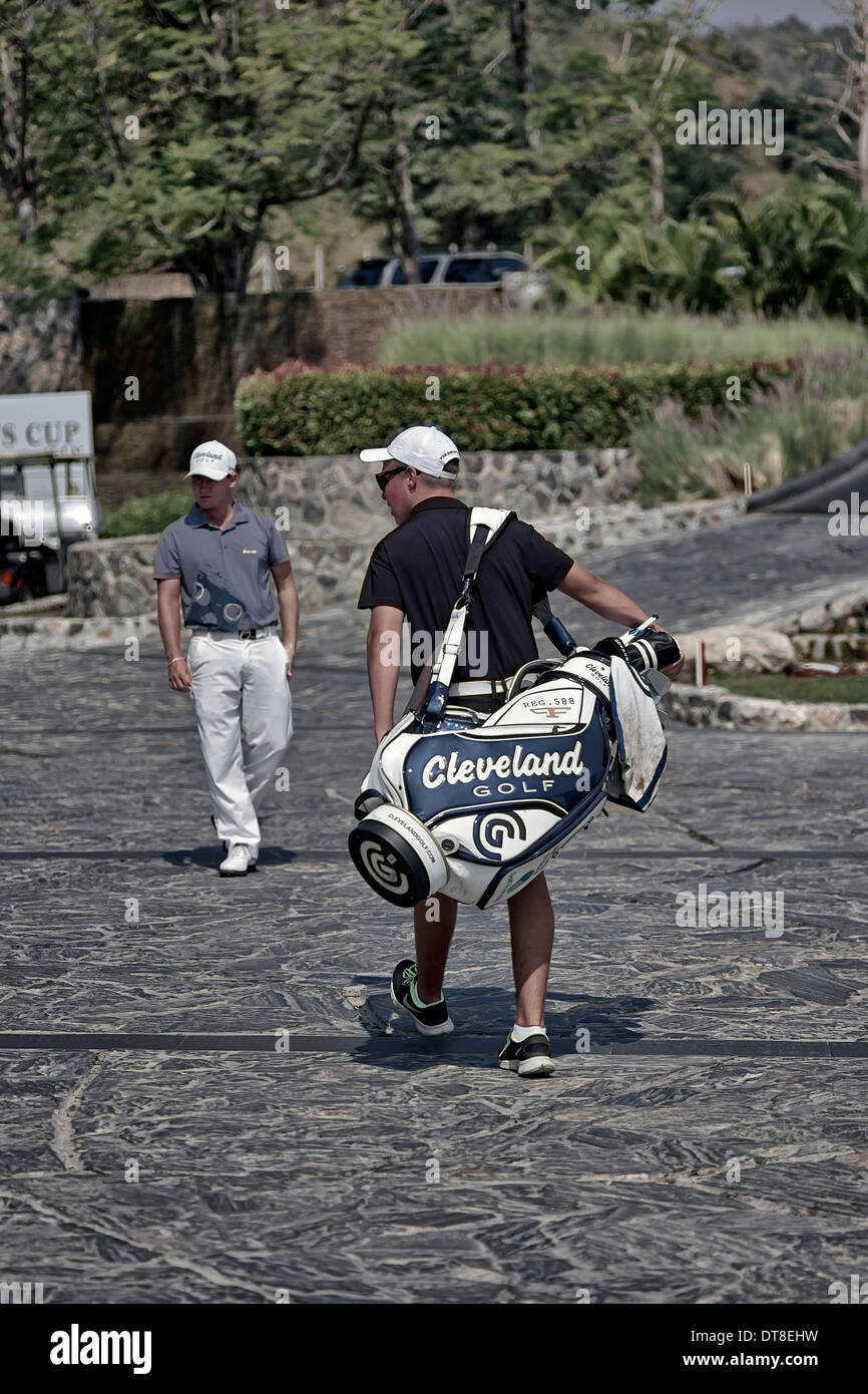 Golfers with caddies hi-res stock photography and images - Alamy