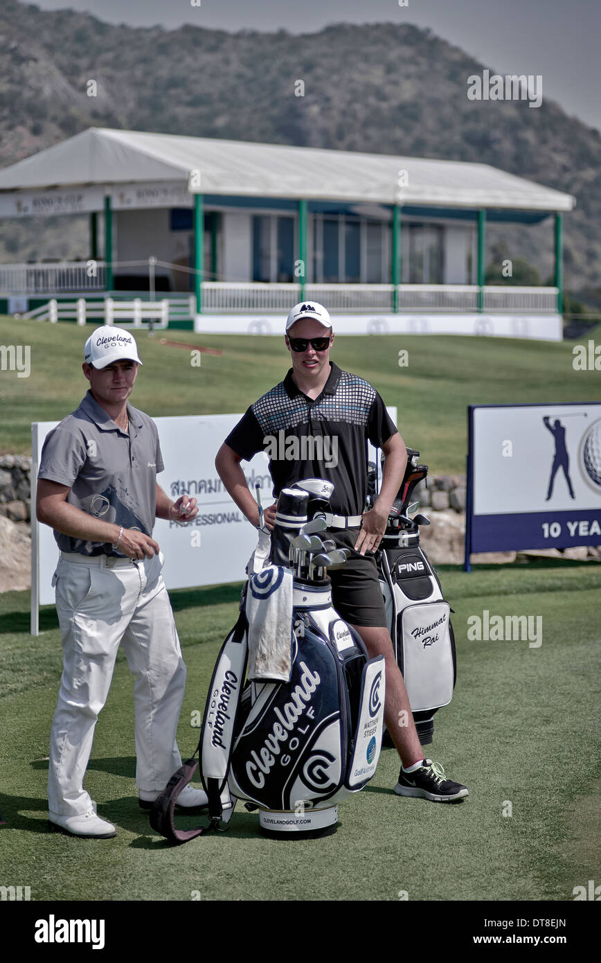 Golfer and caddy Stock Photo - Alamy