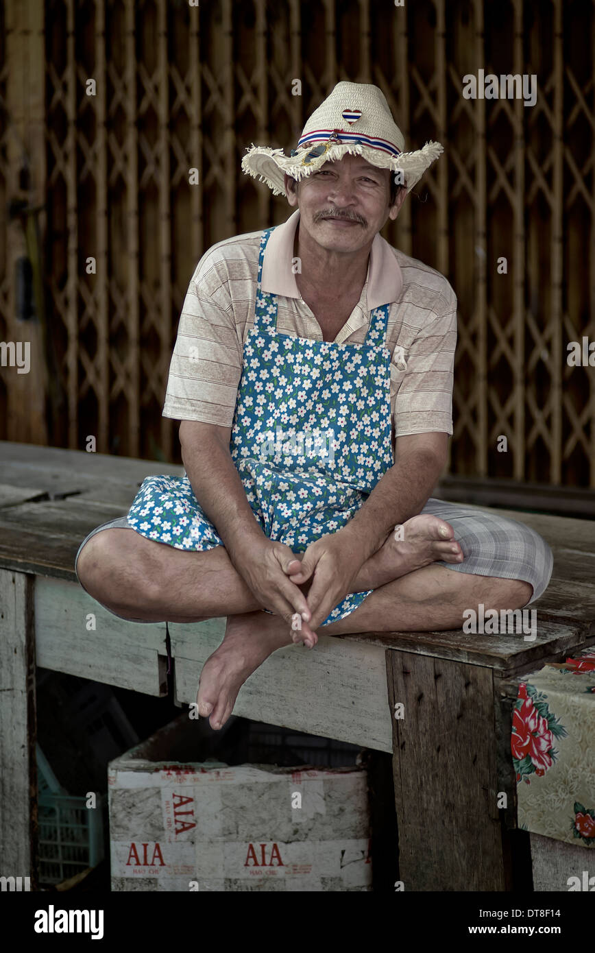 Thai man sat legs folded. Thailand people S. E. Asia Stock Photo - Alamy