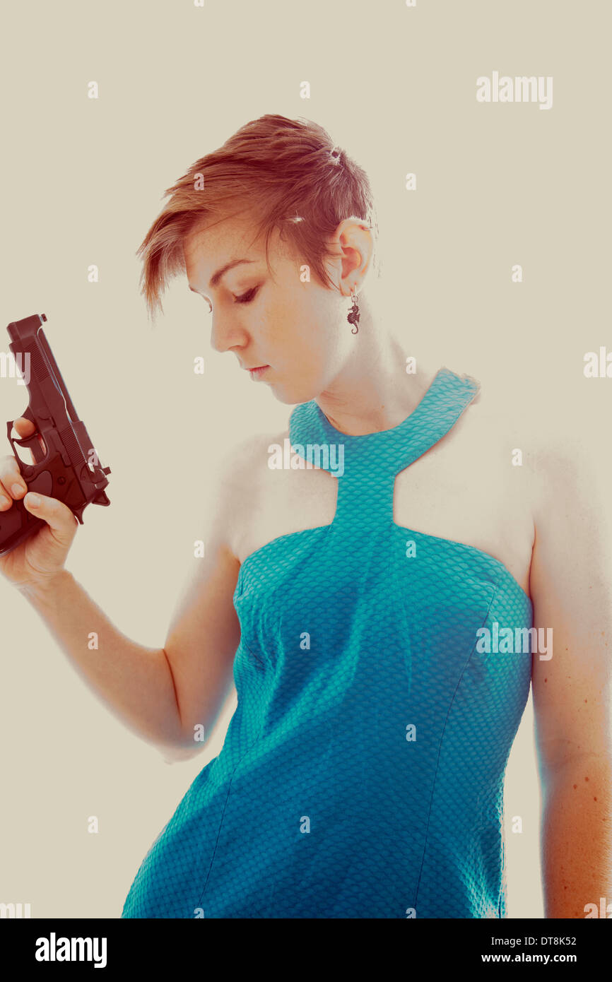 Edgy Girl in Blue with Gun Stock Photo - Alamy