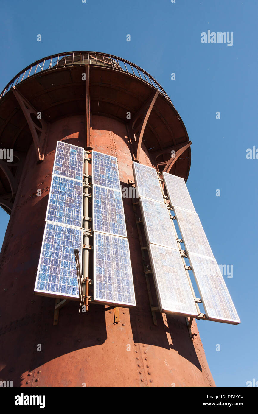 Several solar panels attached to a lighthouse to produce power in order ...