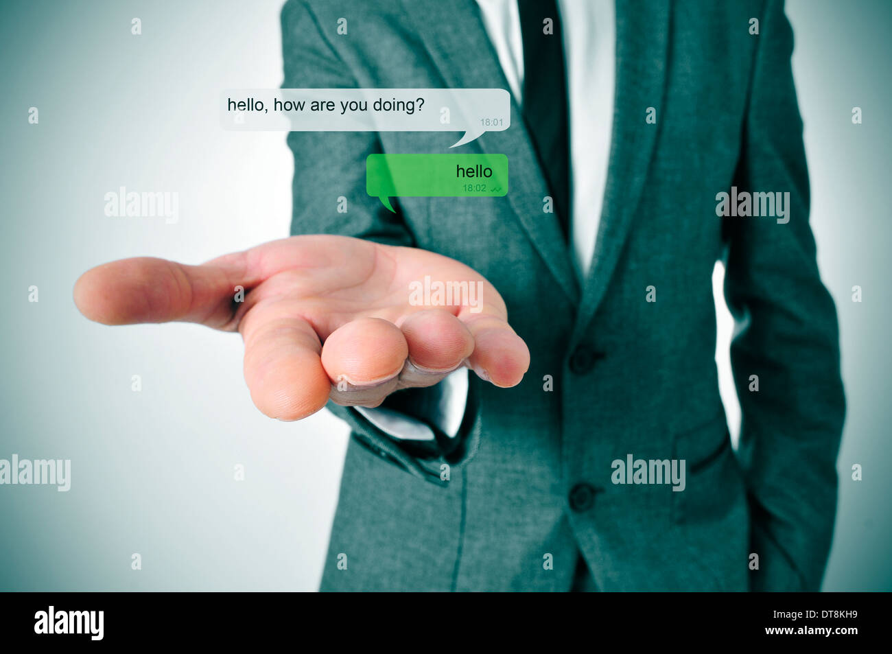 a man wearing a suit and a depiction of an instant messaging chat Stock ...