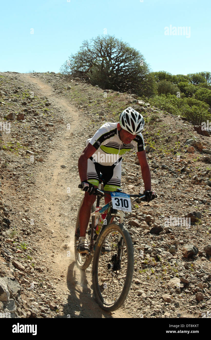 A mountainbike rider competing in an off road trial Stock Photo - Alamy