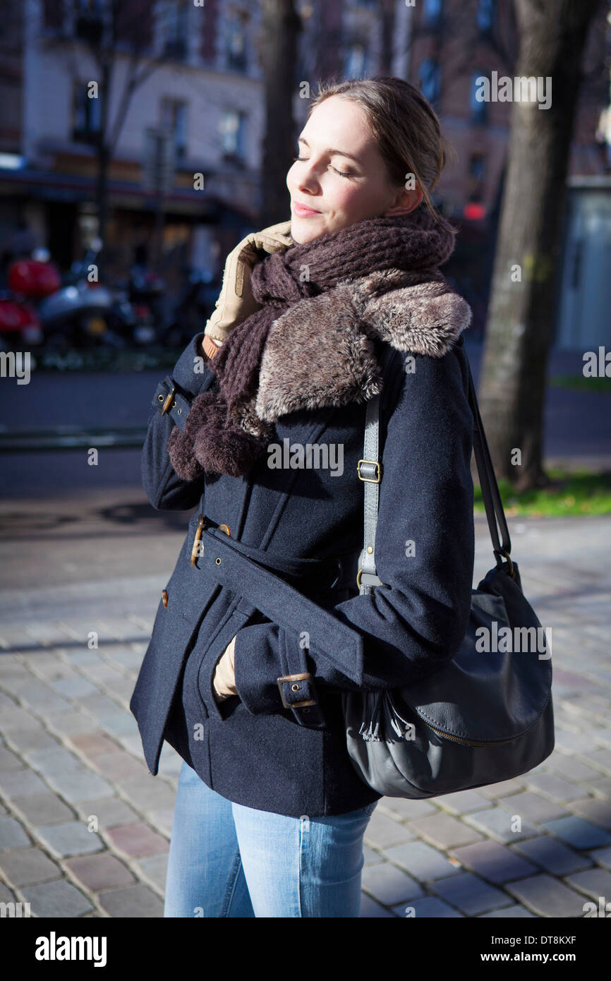 Woman walks smiling in sunny hi-res stock photography and images - Alamy