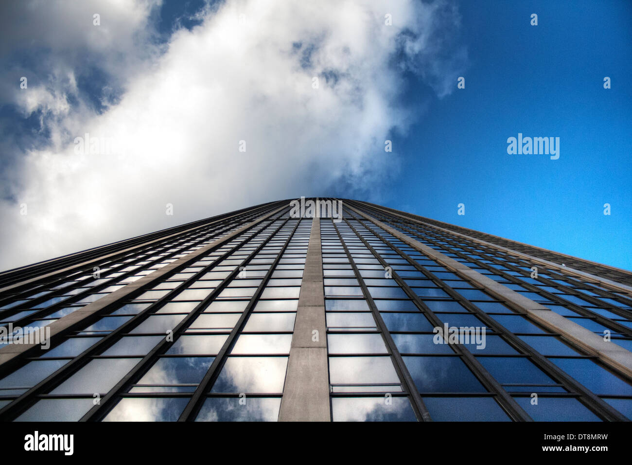 Office Building reflecting clouds in windows Stock Photo - Alamy