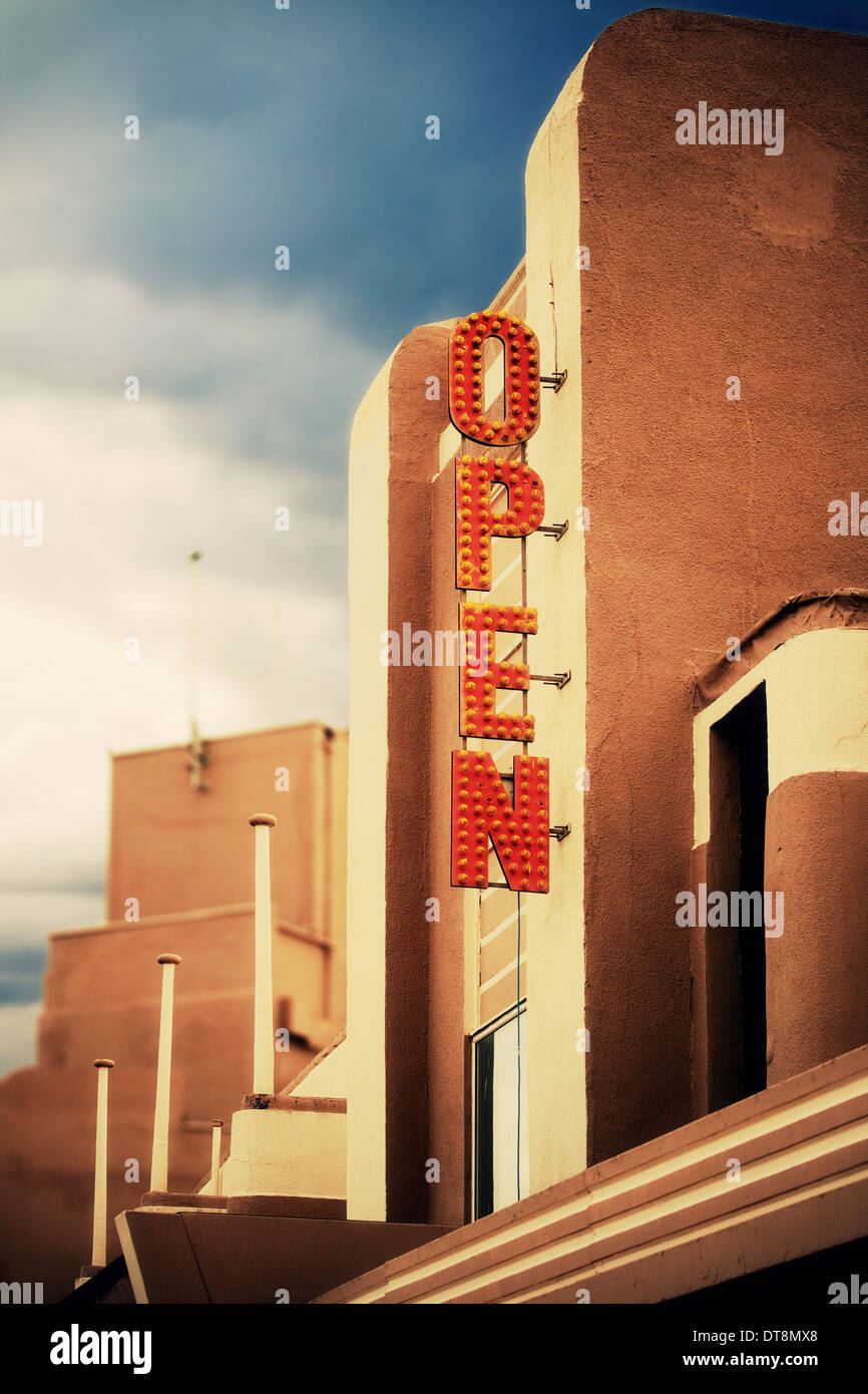 Open sign on the side of a cinema Stock Photo - Alamy