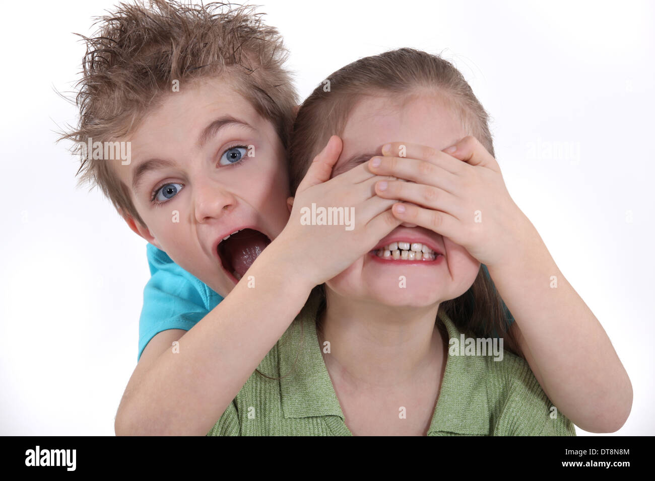 Children playing peek-a-boo Stock Photo - Alamy