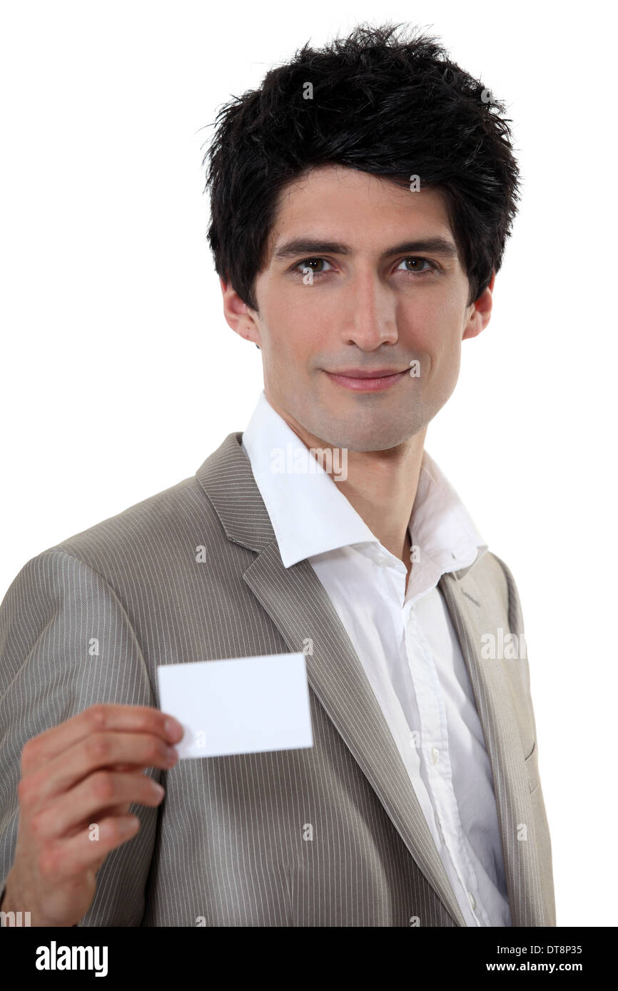 Businessman holding business card Stock Photo - Alamy