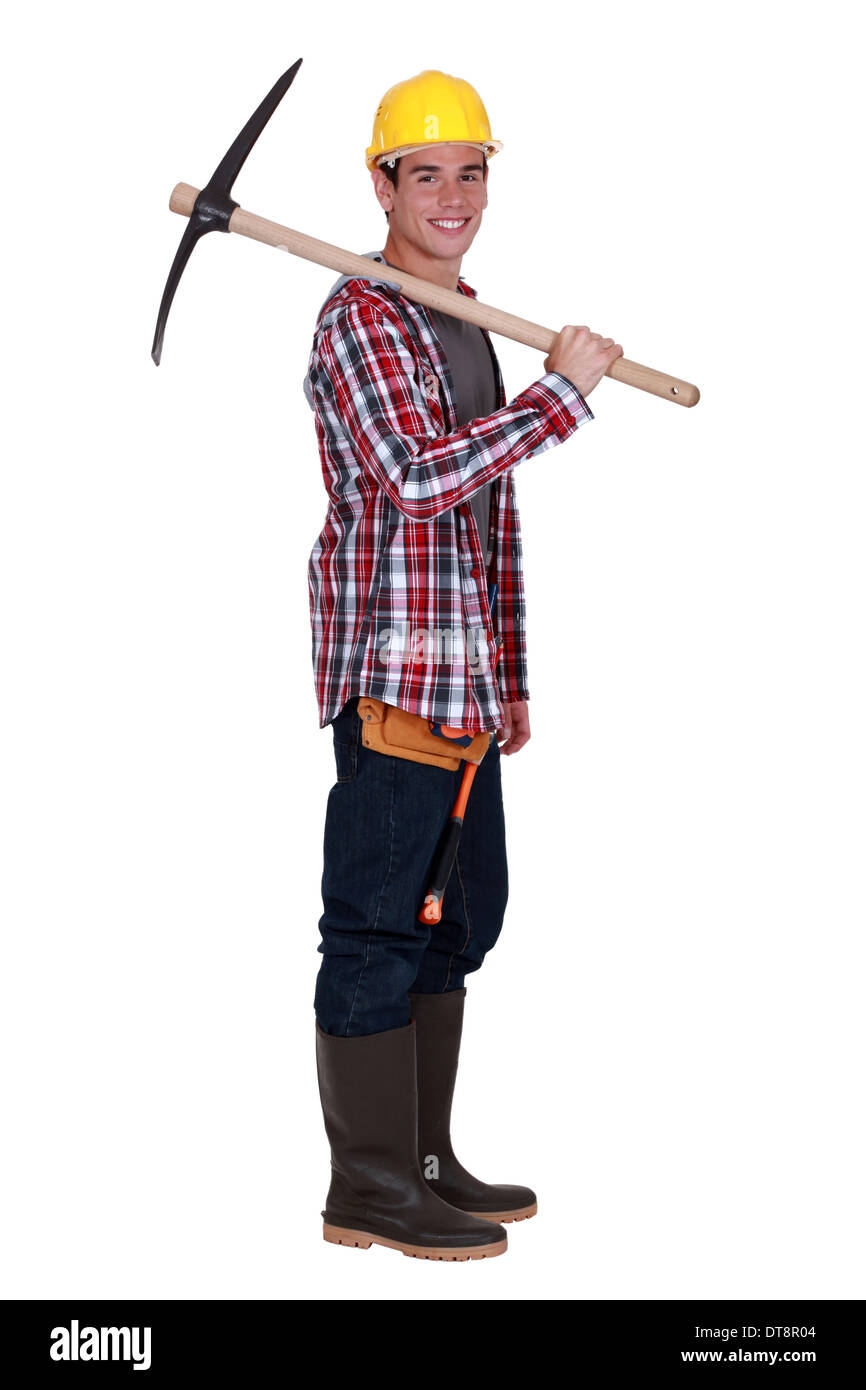 Quarry worker with pick axe Stock Photo - Alamy
