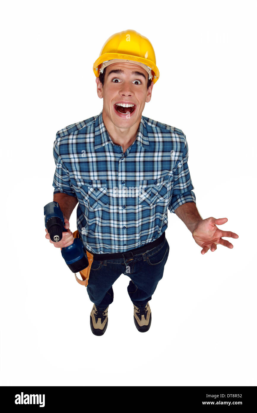 Tradesman holding a power tool Stock Photo - Alamy
