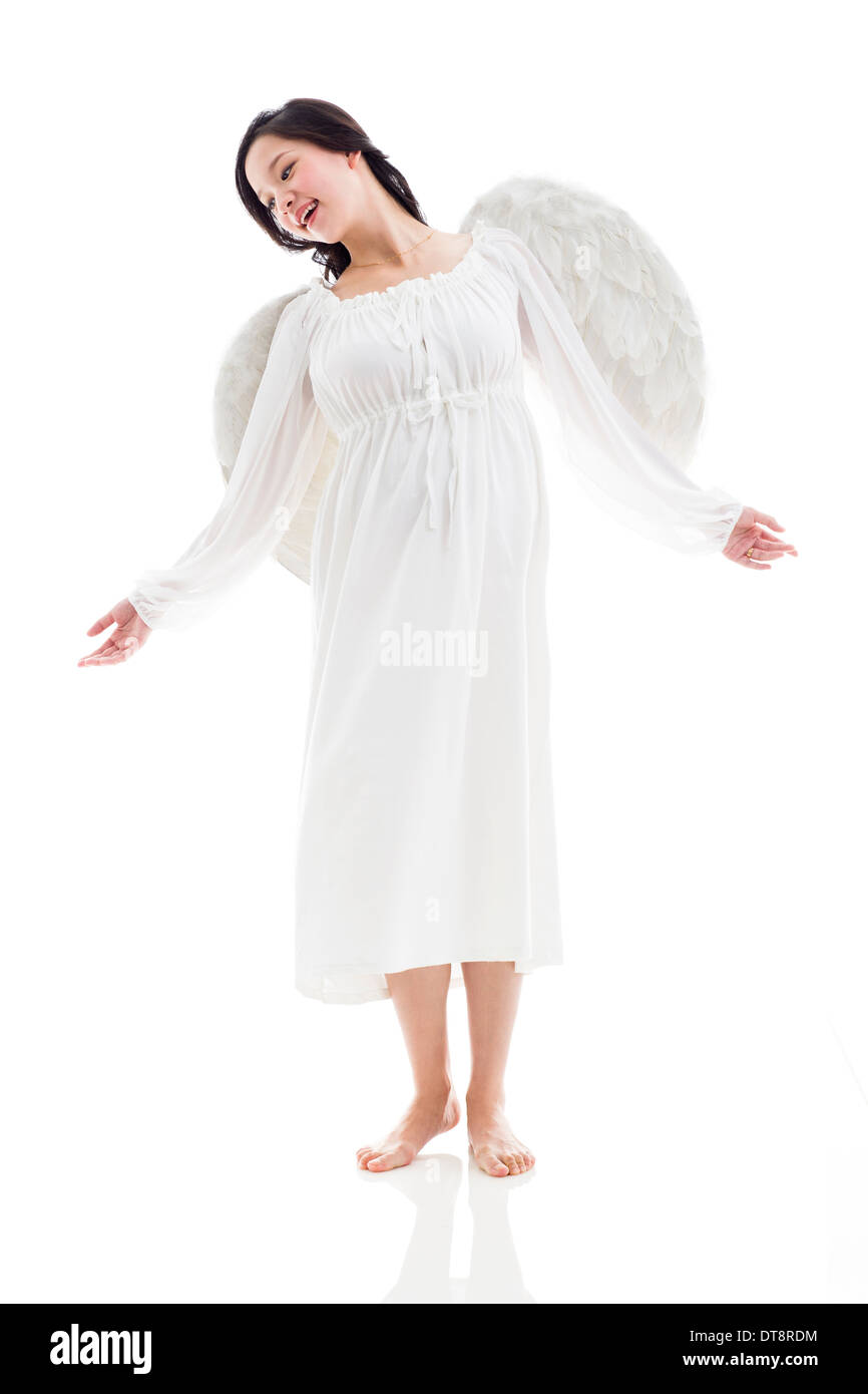 Pregnant woman wearing angel wings Stock Photo - Alamy