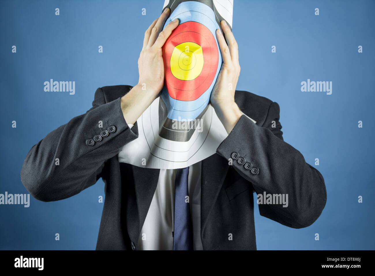 business man holding a target on her face Stock Photo - Alamy