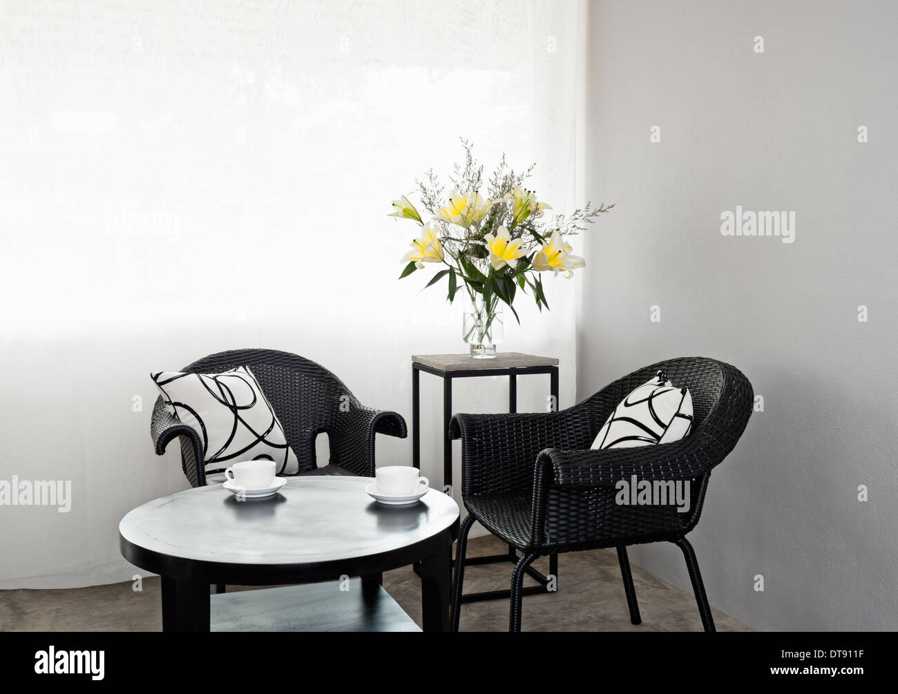 Dark outdoor furniture in a bright setting Stock Photo - Alamy