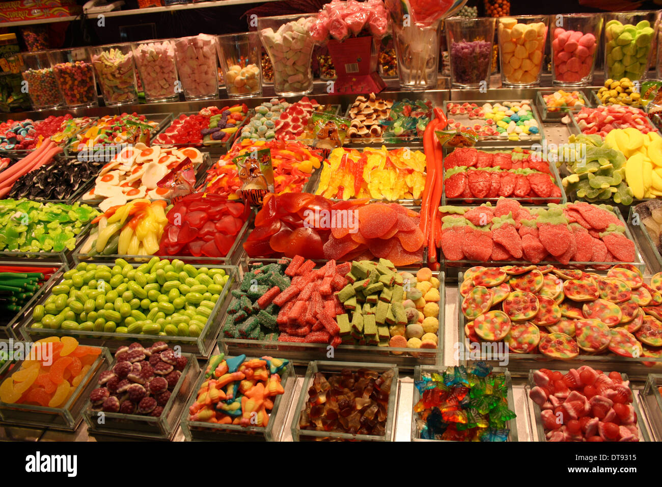 A stall where they are selling sweets. This is a stall at a big market ...