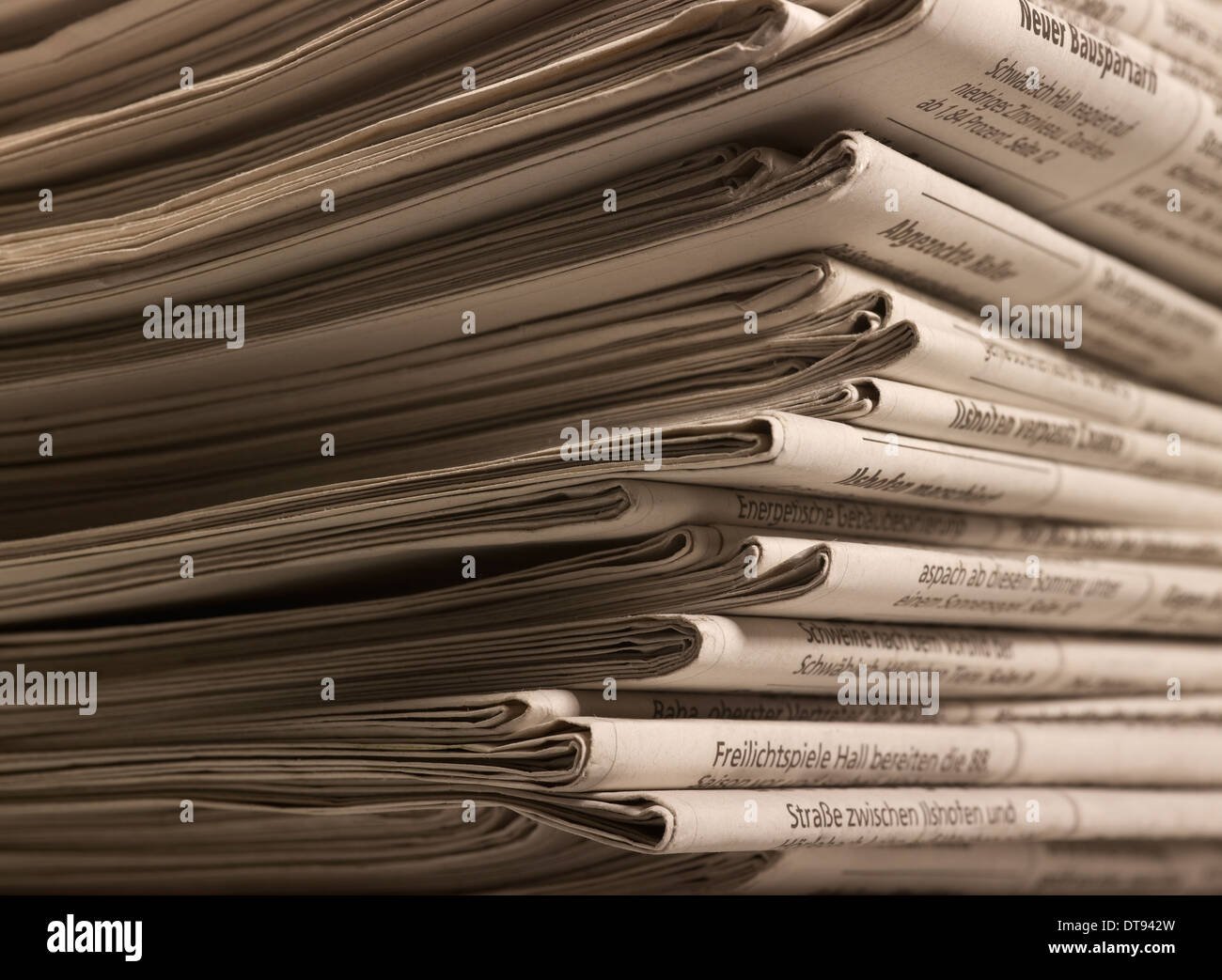 full frame background with lots of stacked newspapers Stock Photo - Alamy