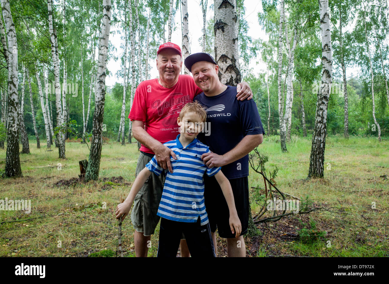 Family of three generations enjoying a moment in the Polish woods ...