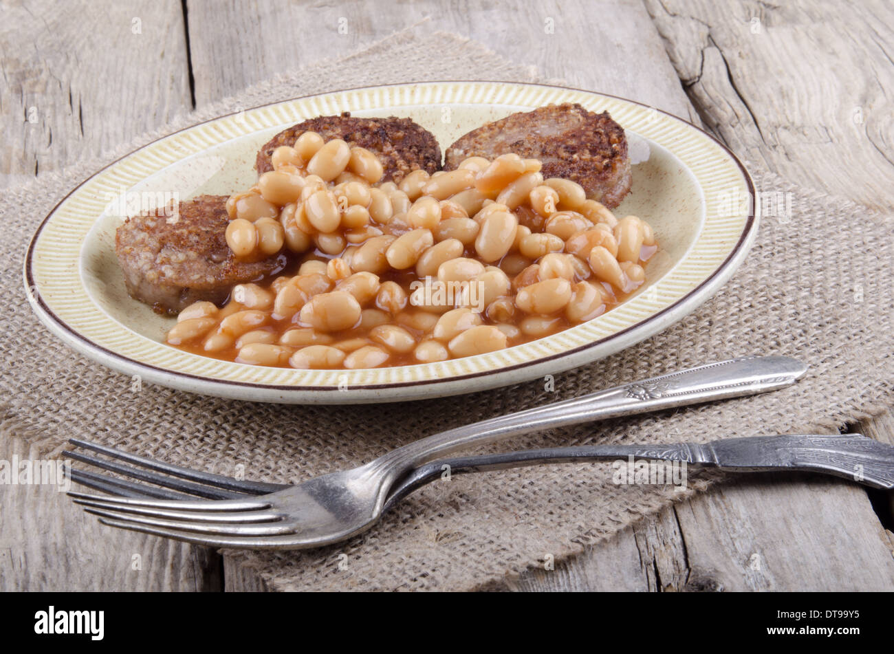 baked beans and fried white pudding on a plate Stock Photo - Alamy