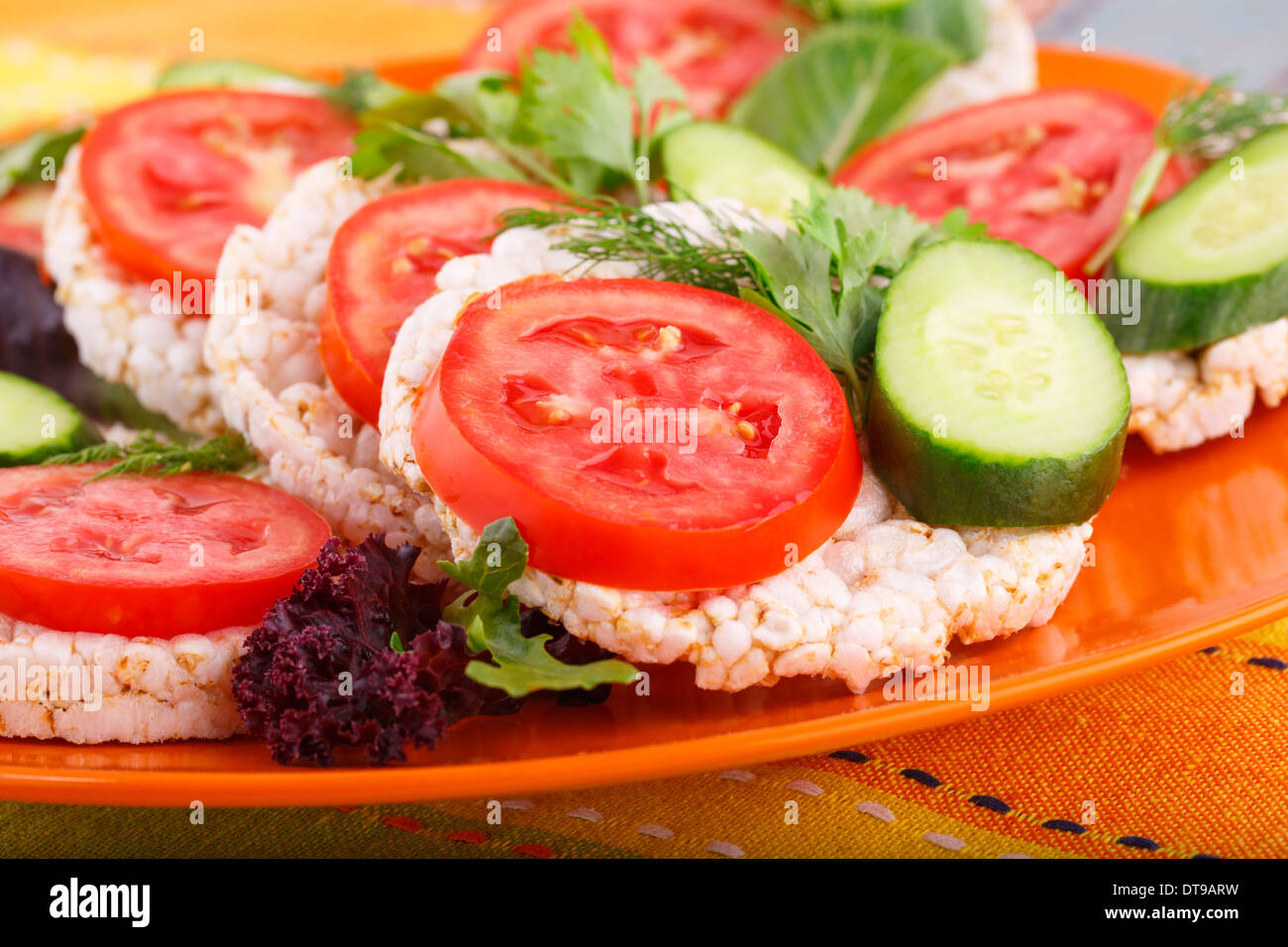 Puffed rice crackers sandwiches with vegetables on plate Stock Photo ...