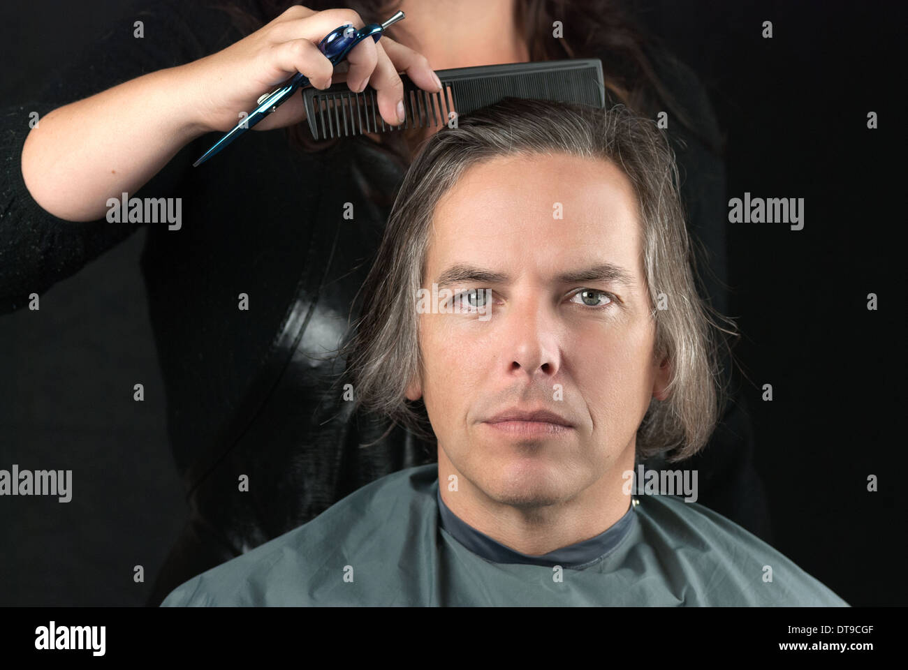 Man Getting Long Hair Combed In Preparation For Cut Stock Photo - Alamy