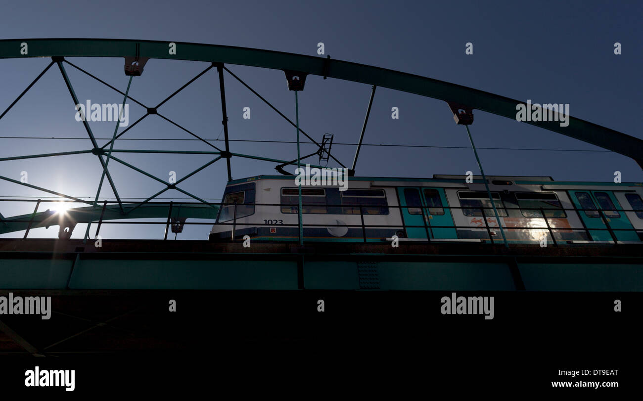 Manchester metro link train crossing the Bridgewater Bridge at the side ...