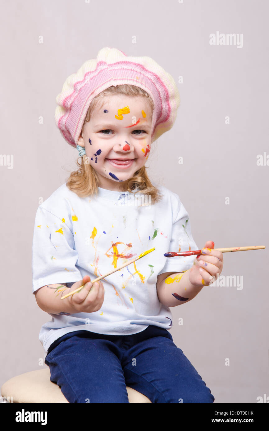 Portrait Of A Three Year Old Girl Playing In The Artist Girl Mud