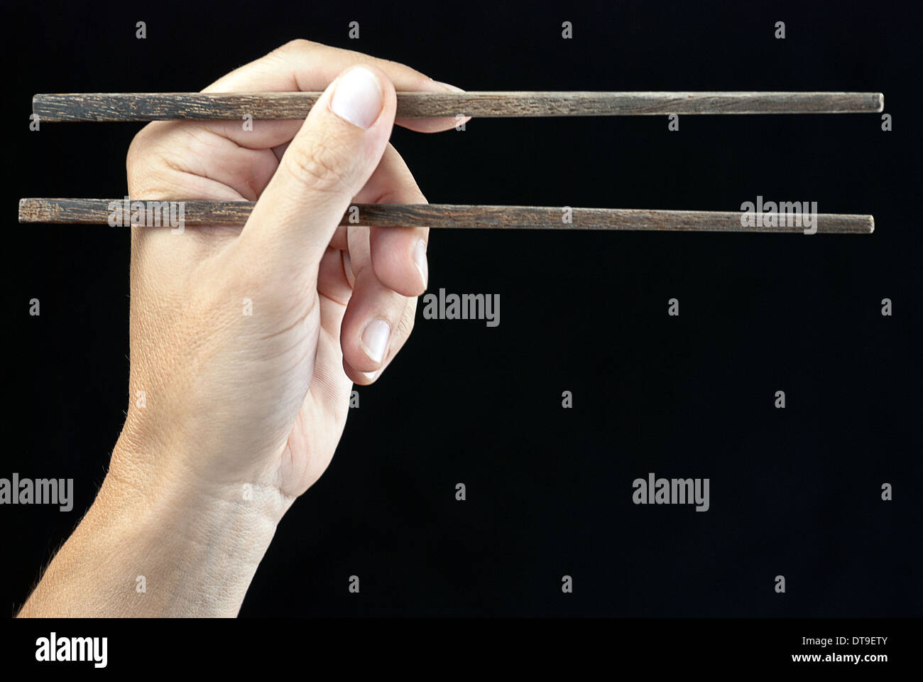 Hand with chopsticks hi-res stock photography and images - Alamy