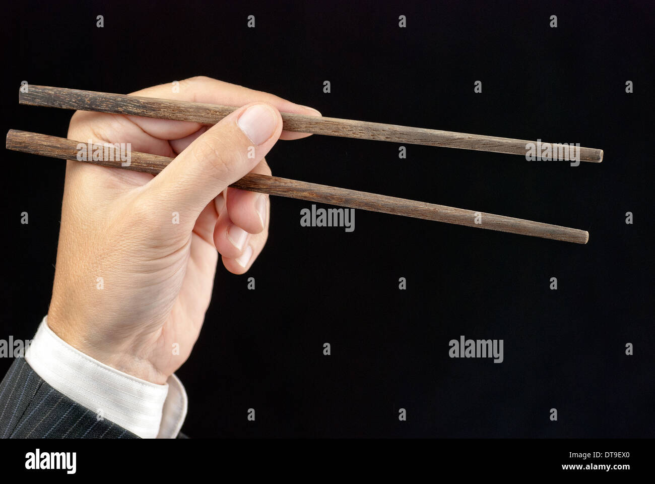Hand with chopsticks hi-res stock photography and images - Alamy