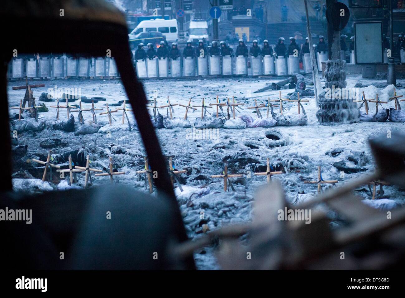Kiev, Ukraine. 8th Feb, 2014. Riot police stand guard with their ...
