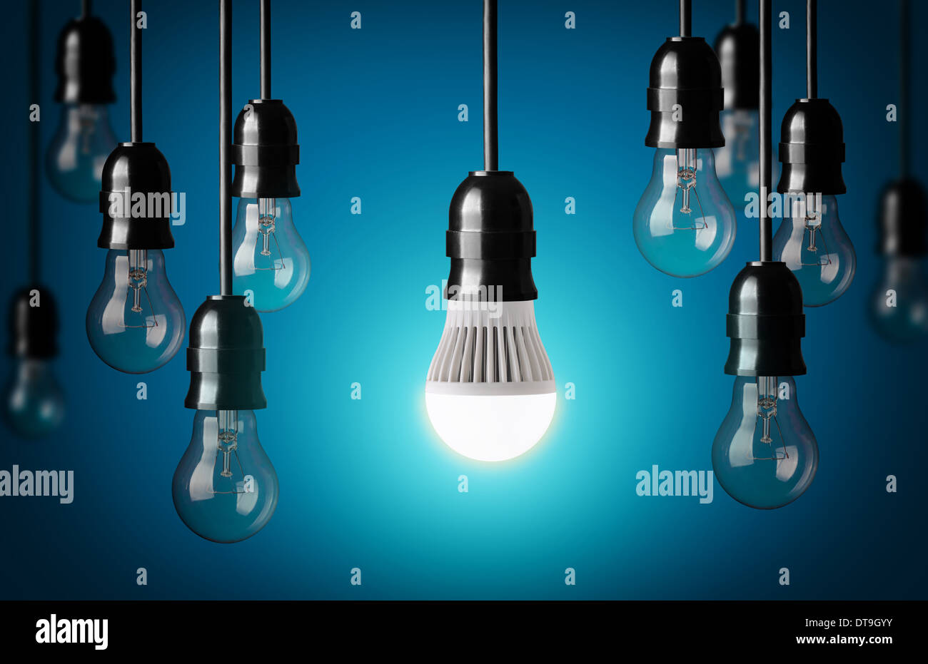 LED bulb and simple light bulbs.Blue background Stock Photo - Alamy
