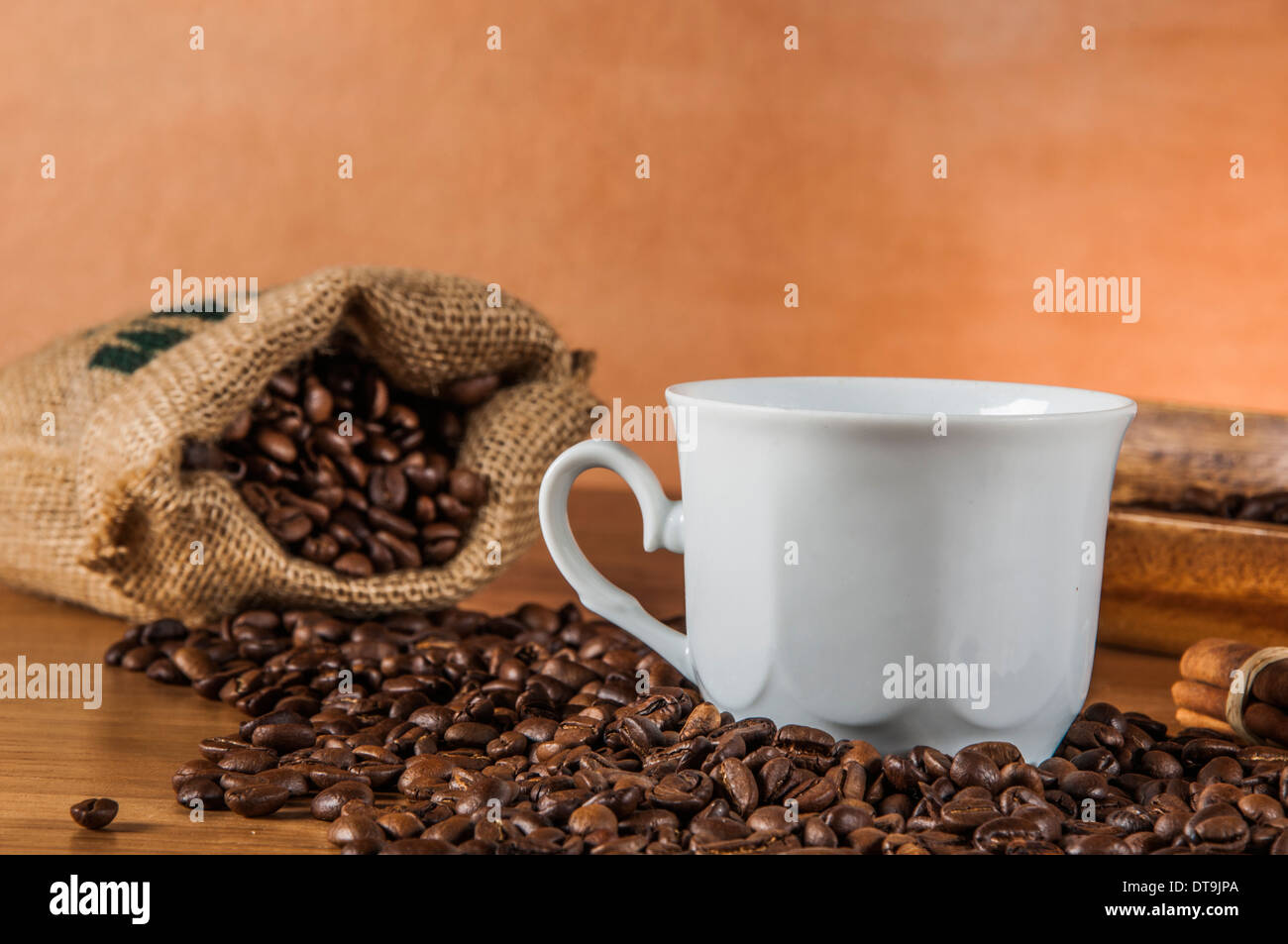 Coffee theme with wooden table and dark background Stock Photo - Alamy